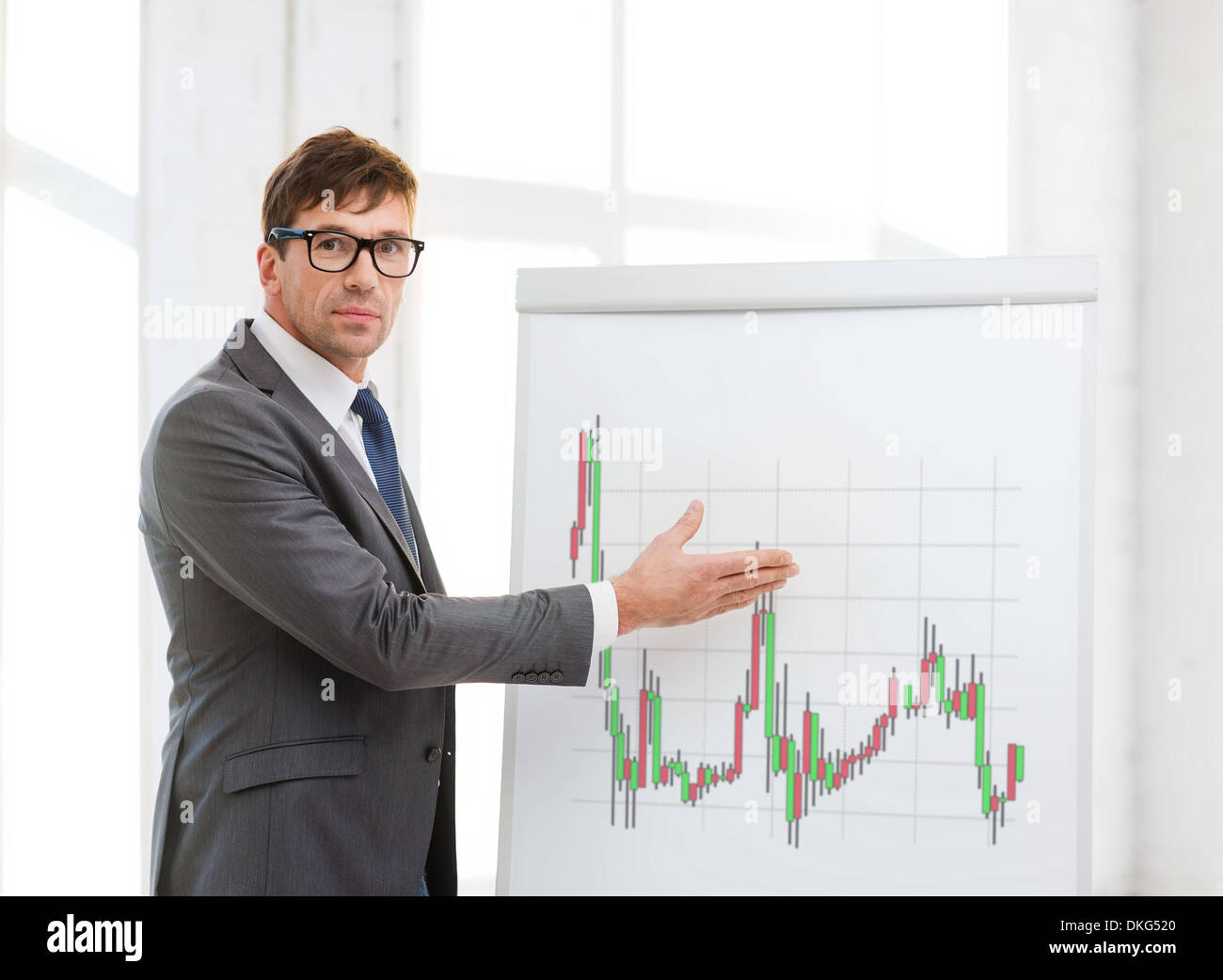 man pointing to flip board with forex chart Stock Photo - Alamy