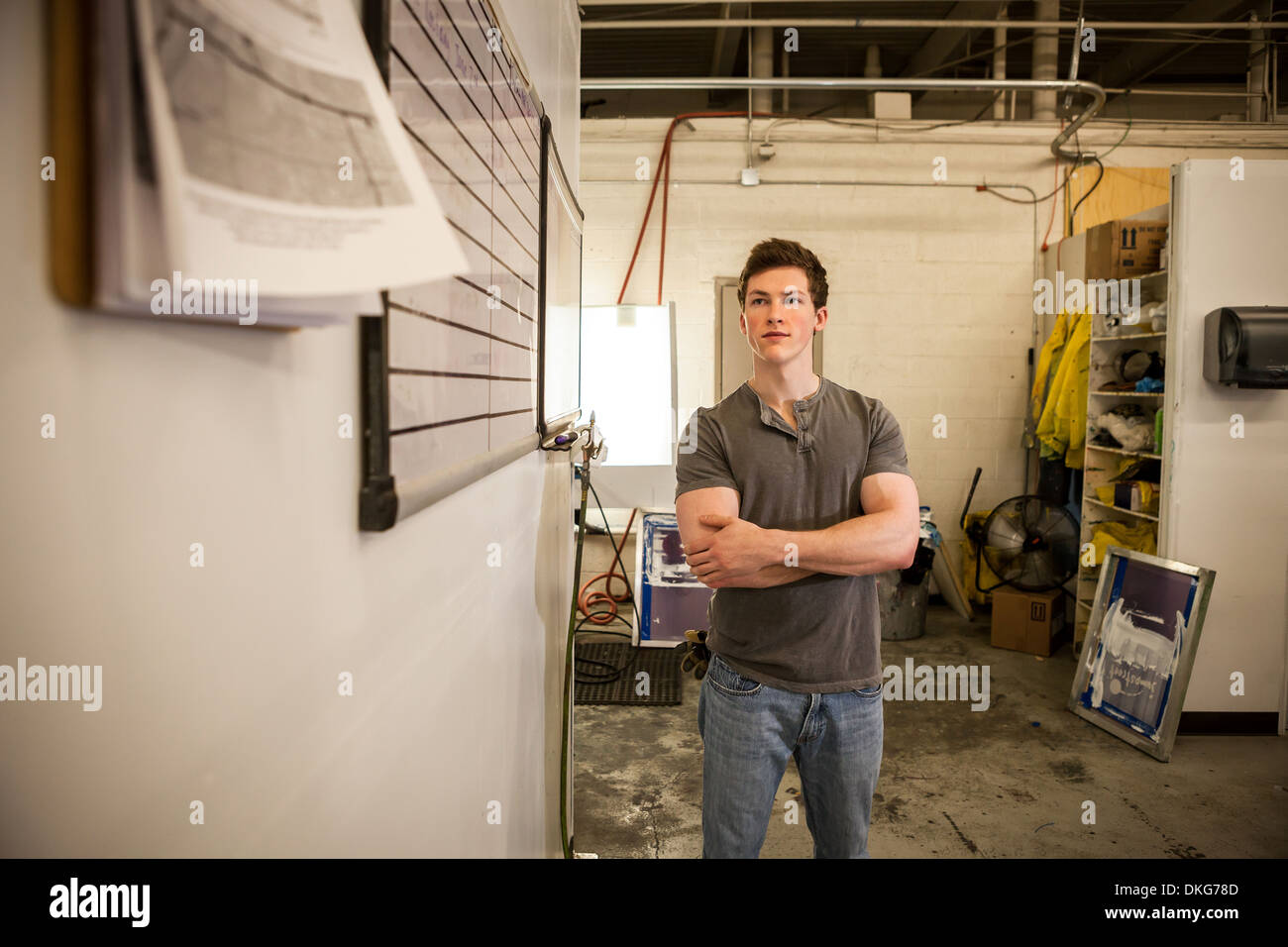 Worker standing in warehouse Stock Photo - Alamy