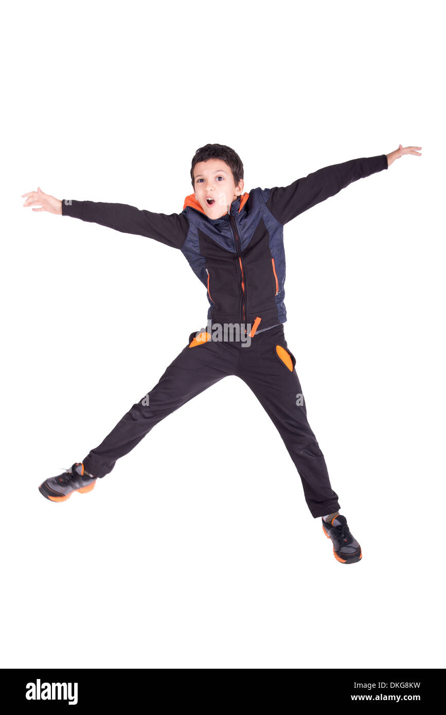 Young boy jumping isolated in white Stock Photo - Alamy