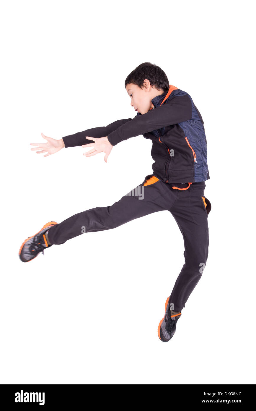 Young boy jumping isolated in white Stock Photo - Alamy