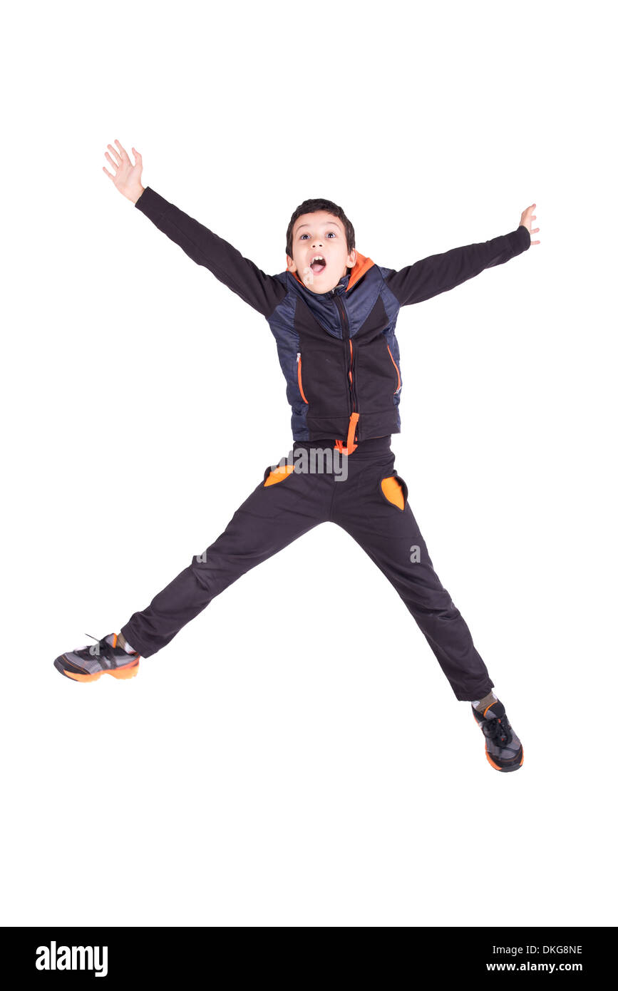 Young boy jumping isolated in white Stock Photo - Alamy