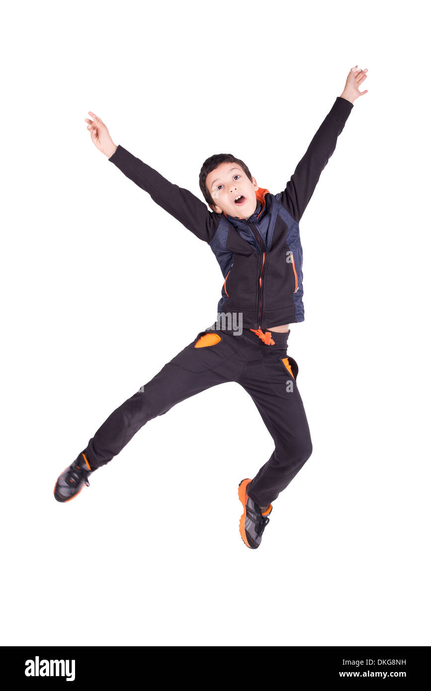 Young boy jumping isolated in white Stock Photo - Alamy