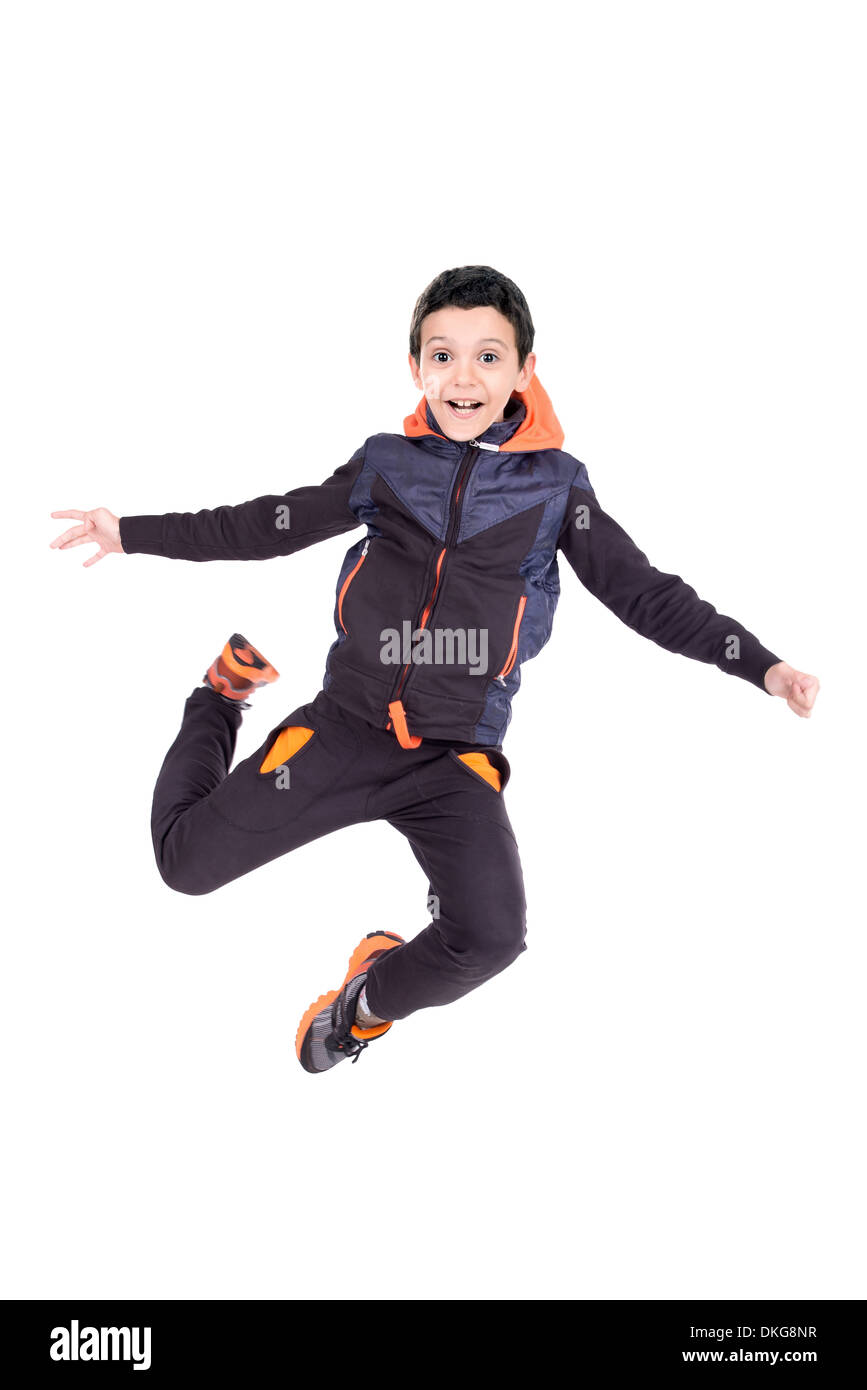 Young boy jumping isolated in white Stock Photo - Alamy