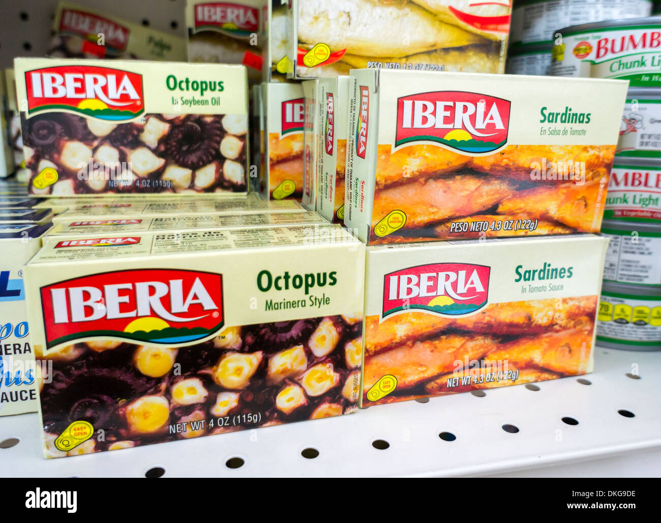 Cans of Iberia brand octopus and sardines in tasty sauces in a ...