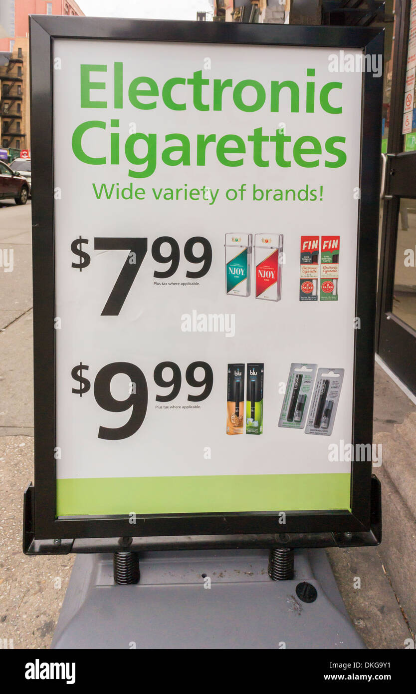Advertising for electronic cigarettes outside of a convenience store in ...