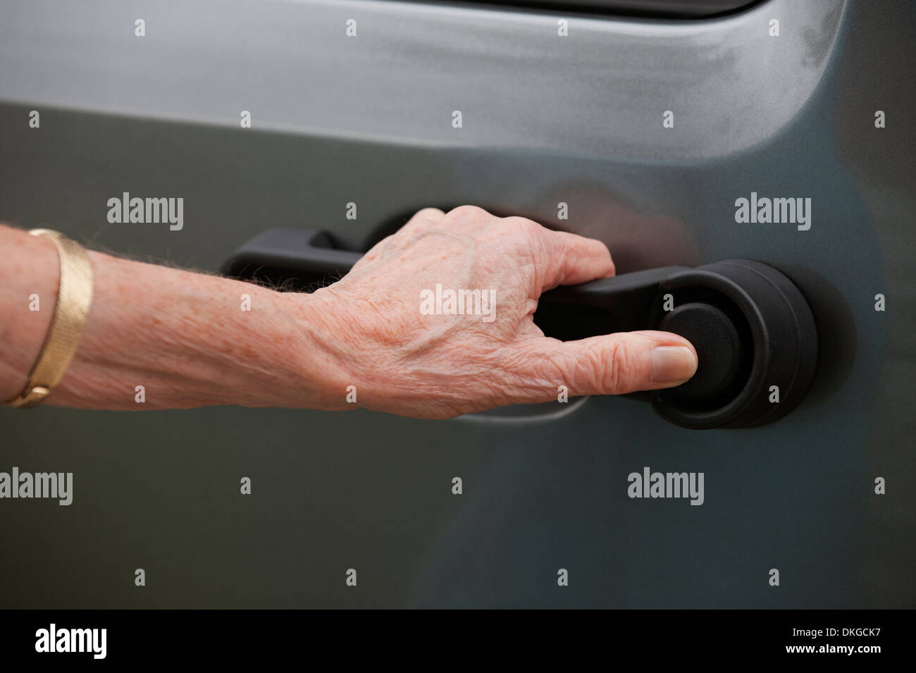 Woman's hand opening car using the door handle Stock Photo - Alamy
