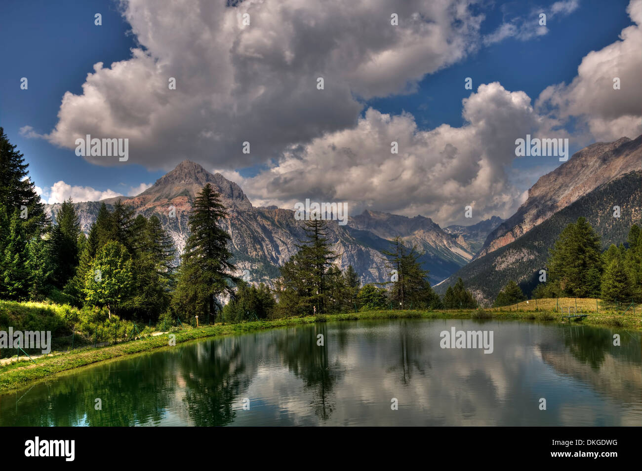 Alpine landscape with lake reflection Stock Photo - Alamy