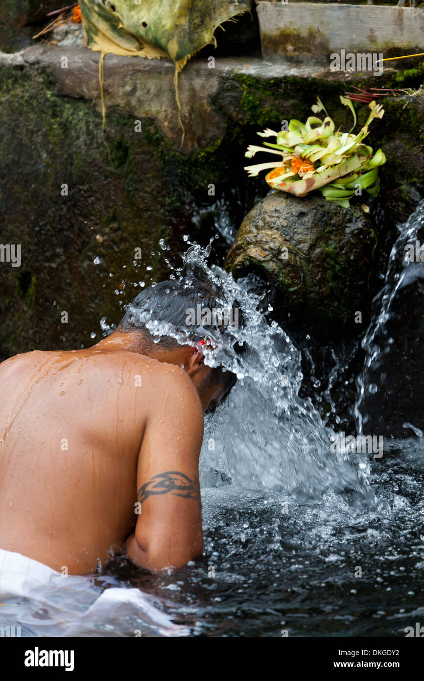Ritual Washing in the Water Basin of the Temple Tirtha Emphul on Bali ...