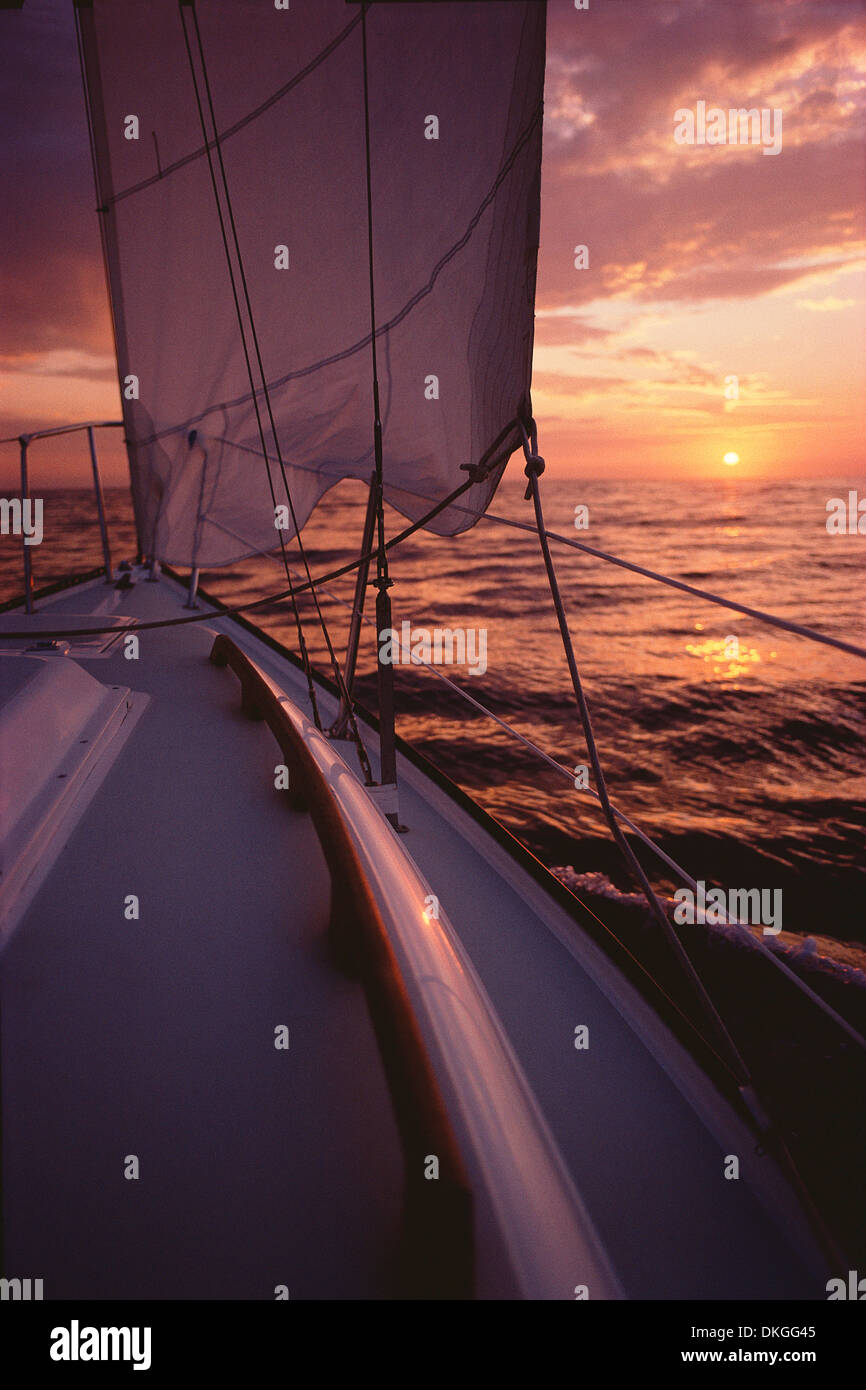 Ocean Sailing into Sunset Stock Photo - Alamy