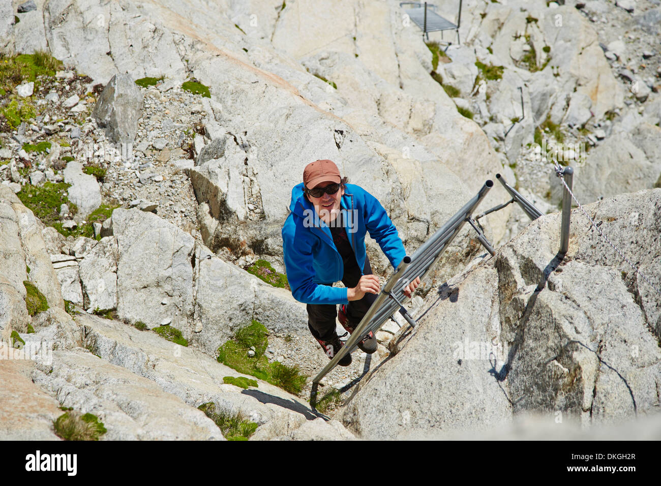 Man up ladder hi-res stock photography and images - Alamy