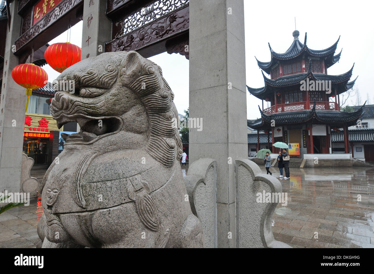 Lion statue in front of gateway to Qibao Old Street area in Minhang ...