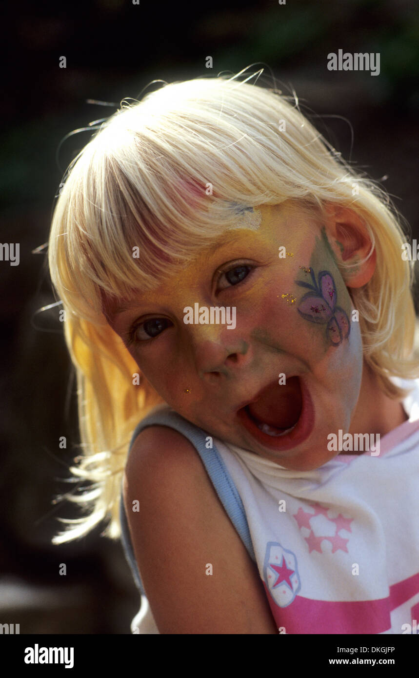 Young child pulling face Stock Photo - Alamy