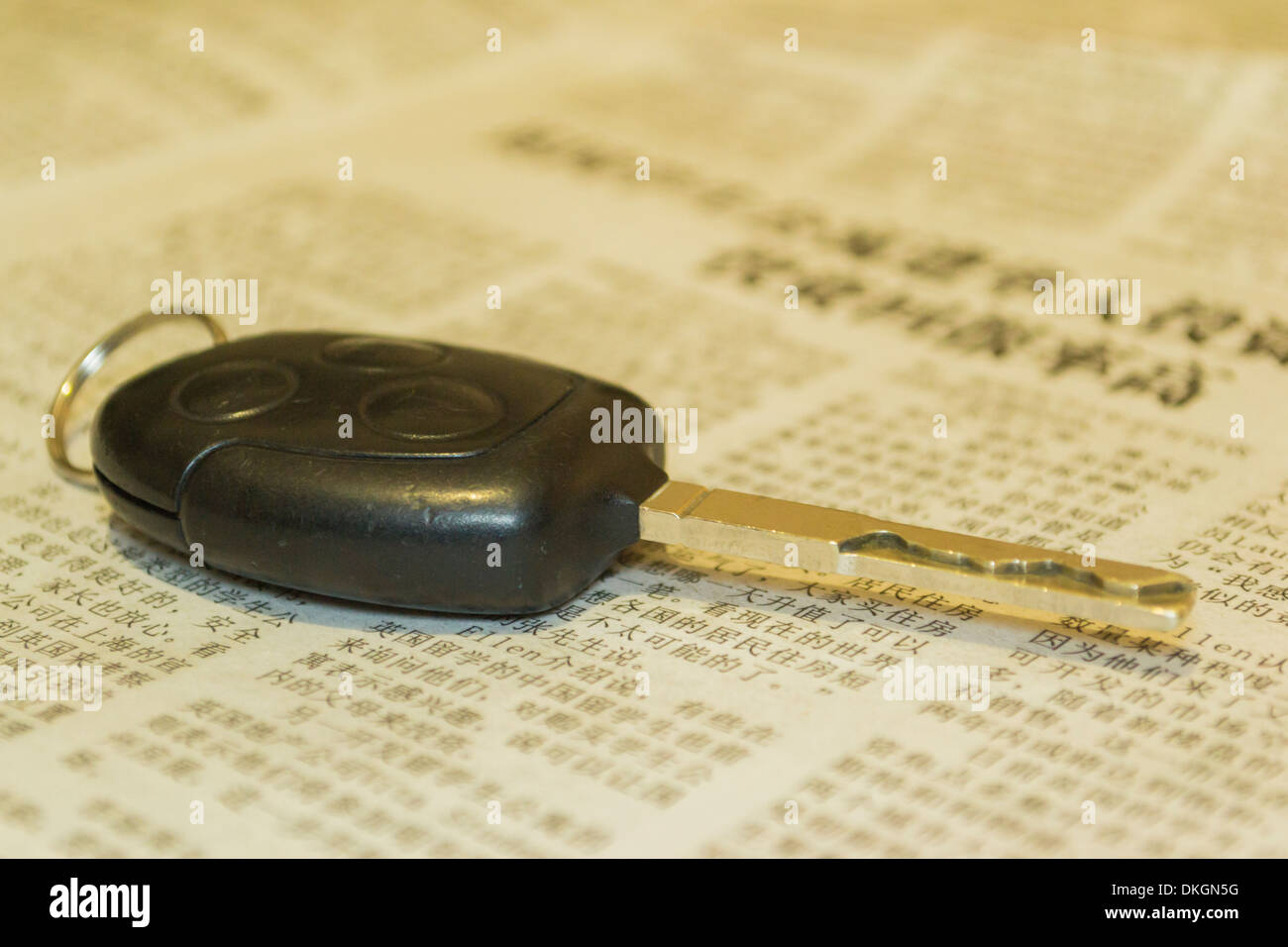 Car keys on a Chinese newspaper Stock Photo - Alamy