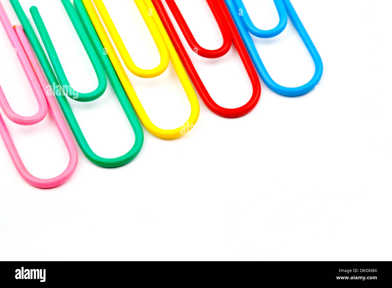 Abstract shot of Paper Clips over a white background Stock Photo - Alamy