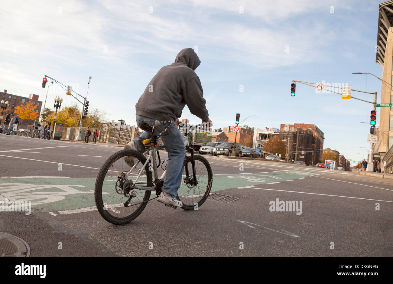 Bicyclists use the painted bike lanes on streets in Boston ...
