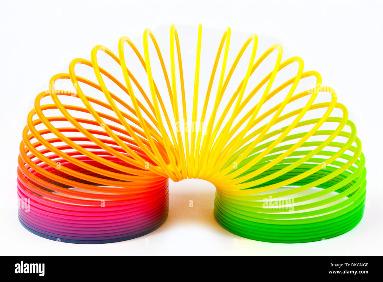 Slinky Toy isolated over a plain white background Stock Photo - Alamy