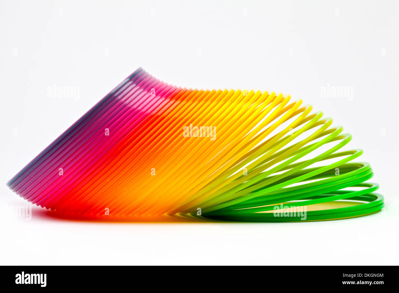 Slinky Toy isolated over a plain white background Stock Photo - Alamy