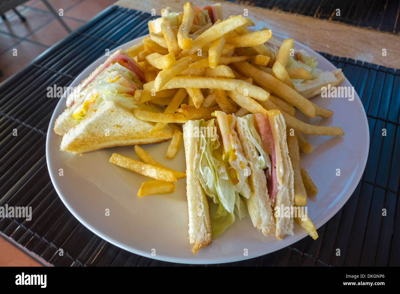 Club sandwich with fries Stock Photo - Alamy