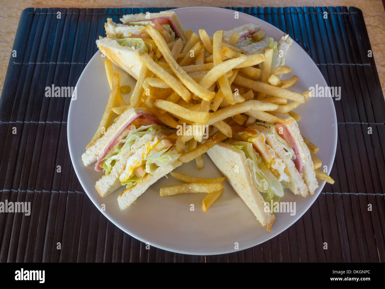 Club sandwich with fries Stock Photo - Alamy