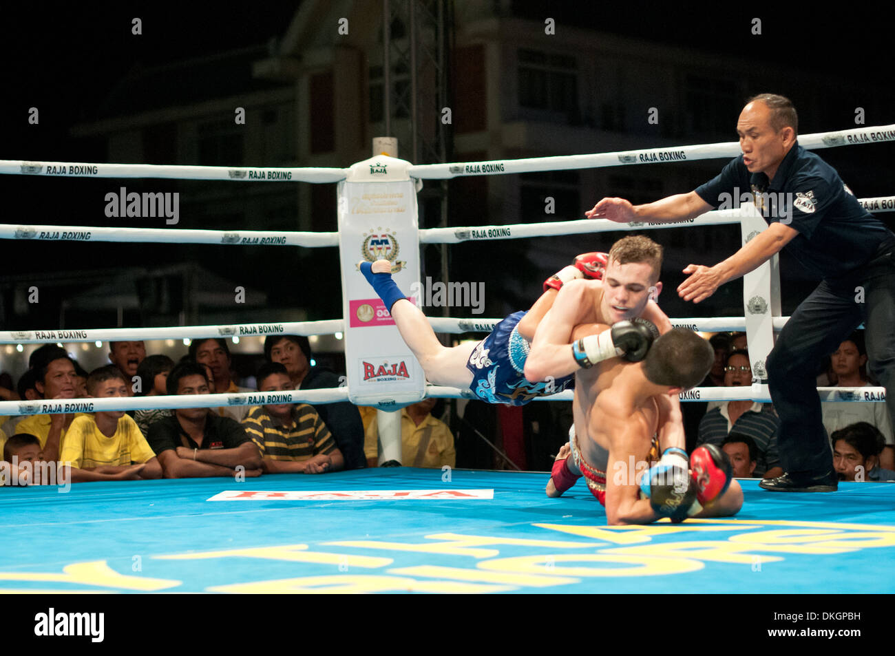 English Thai boxer throws his opponent to the ground Stock Photo - Alamy