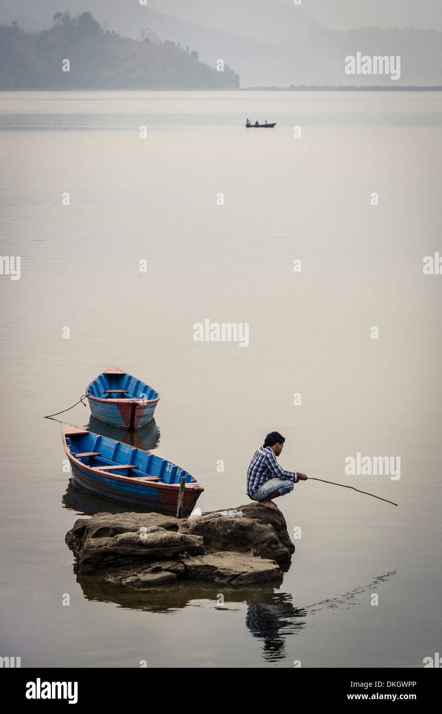 A man fishing on Phewa Tal (Phewa Lake), Pokhara, Nepal, Asia Stock ...