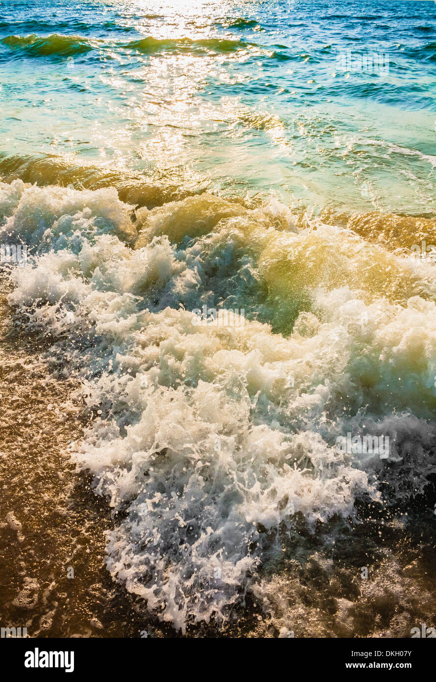 Soft sea ocean waves wash over sand background. Sunset, sunrise Stock ...