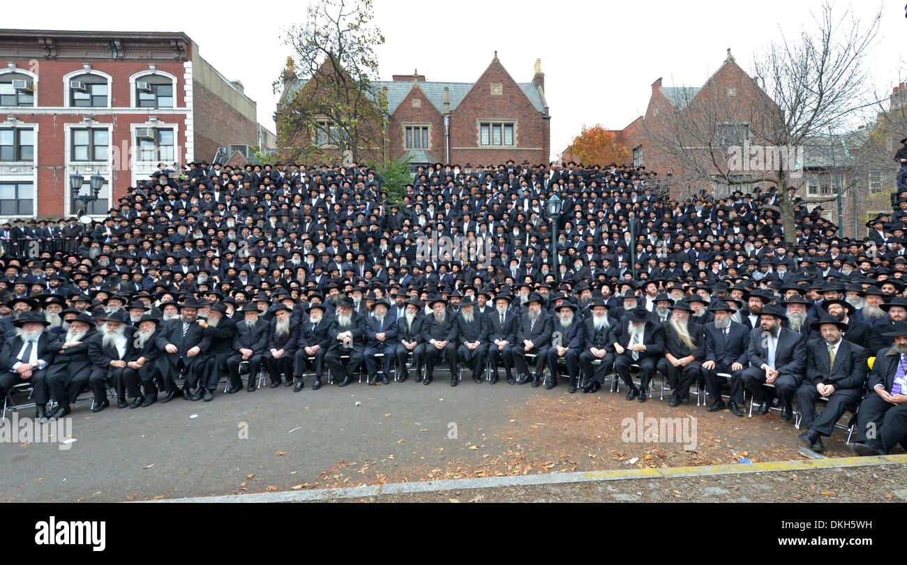 Thousands of orthodox rabbis seated preparing for a group photo at the ...