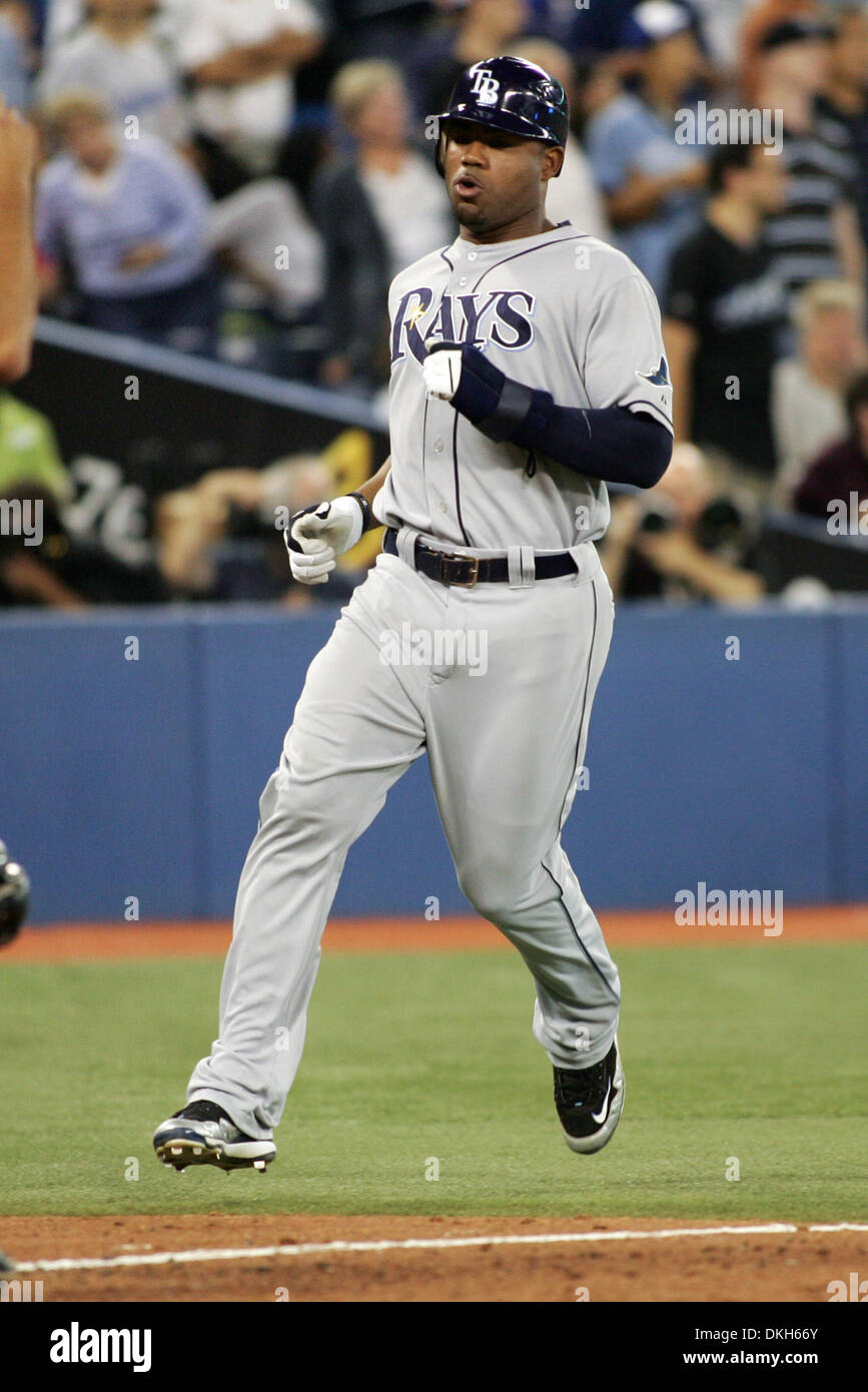 Tampa Bay Rays left fielder Carl Crawford rounds first base in a game ...