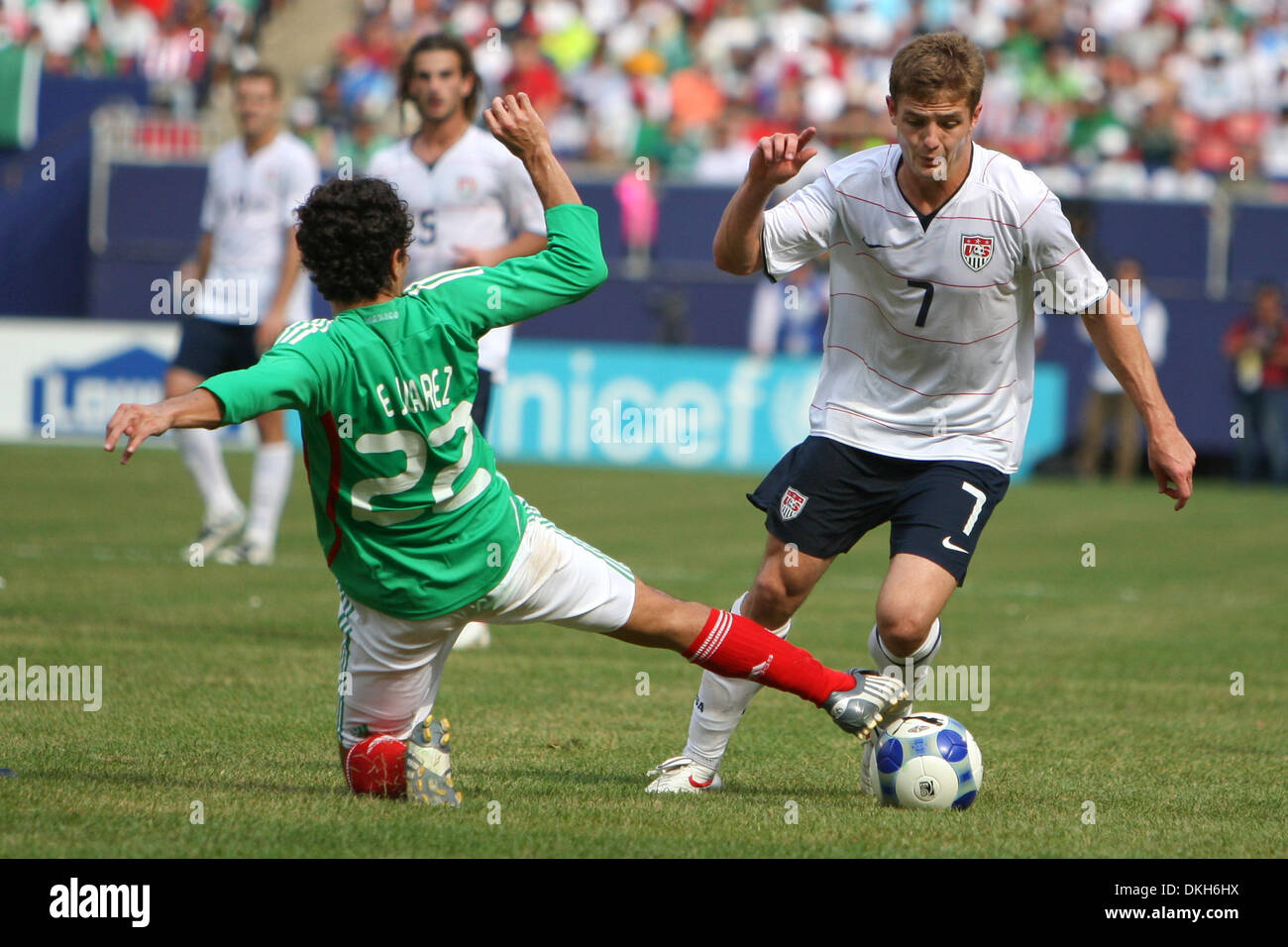No. 22 Juarez attempts to keep the ball from #7 Robbie Rogers. Mexico ...