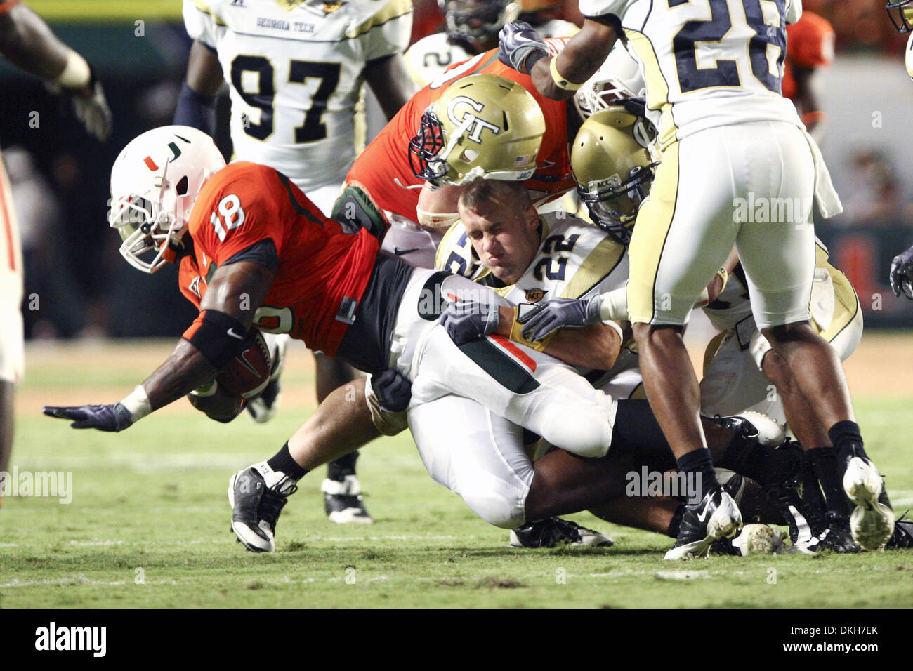 Georgia Tech safety Cooper Taylor (22) losses helmet while trying to tackle Miami Hurricanes ...
