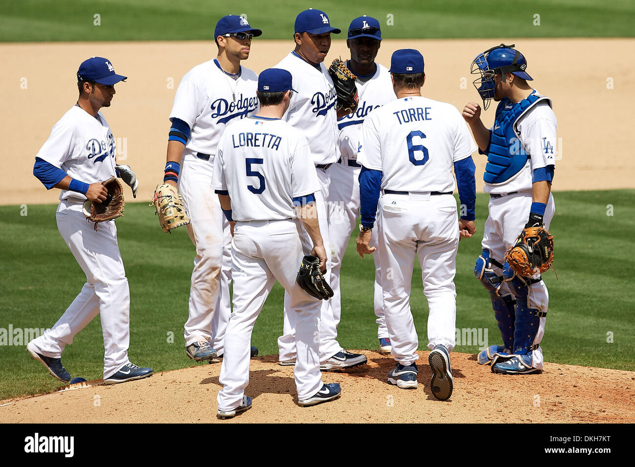 Dodger Manager Joe Torre #6, gives instructions to his infield on how ...