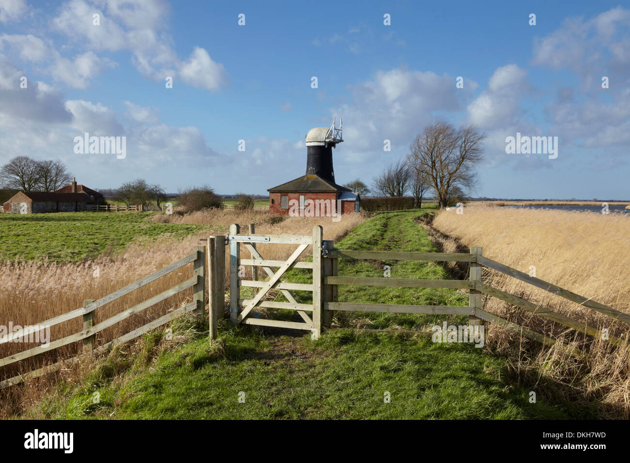 A bright winter day in the Norfolk Broads showing Tall Mill near Upton ...