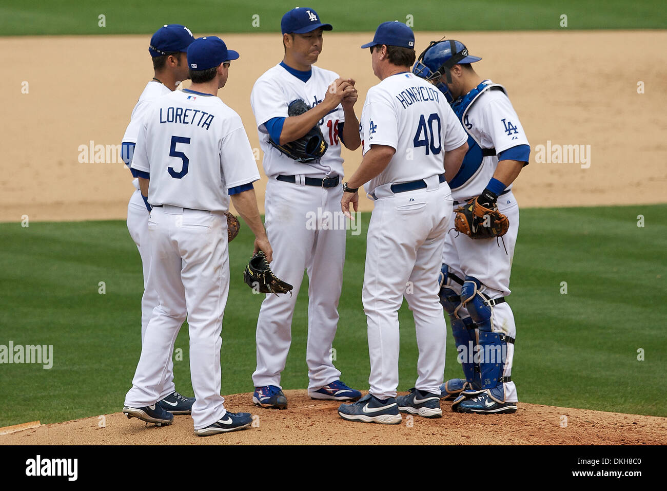 Pitching Coach Rick Honeycutt, discusses pitching options with starting ...