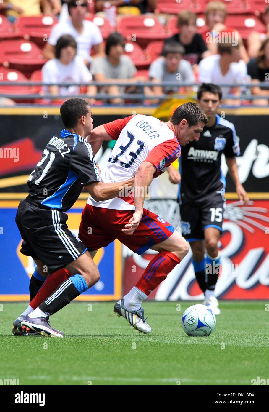 FC Dallas forward Kenny Cooper battles against Arturo Alvarez in a 2-2 ...