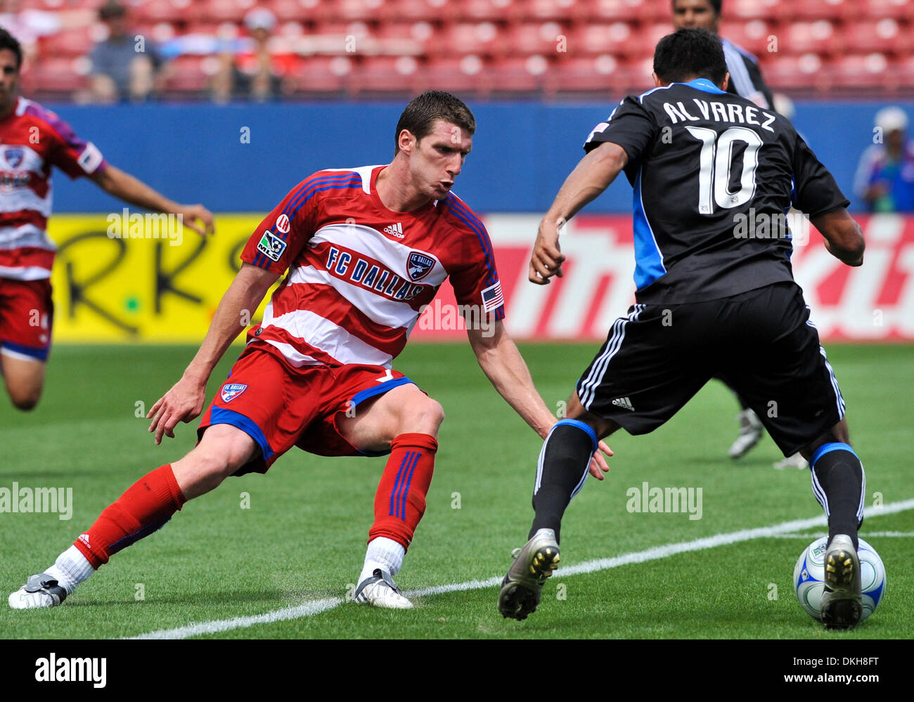 FC Dallas forward Kenny Cooper looks to defend against Arturo Alvarez ...