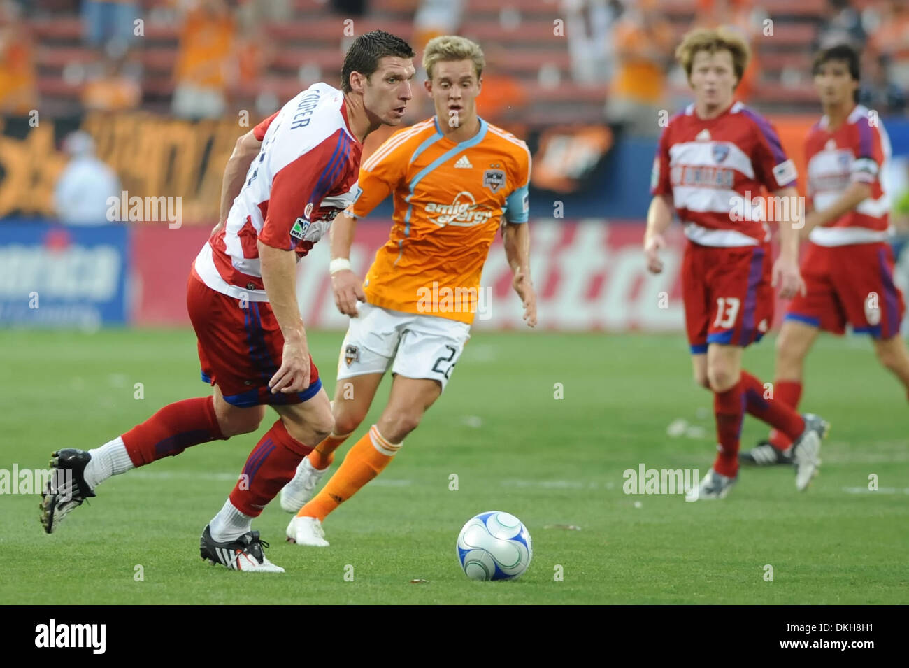 FC Dallas forward Kenny Cooper looks to pass the ball as Dynamo prevail ...