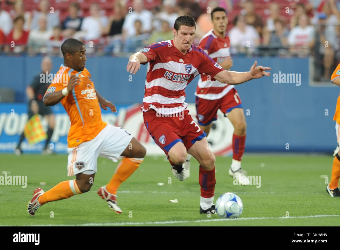 FC Dallas forward Kenny Cooper fights for ball position as Dynamo ...