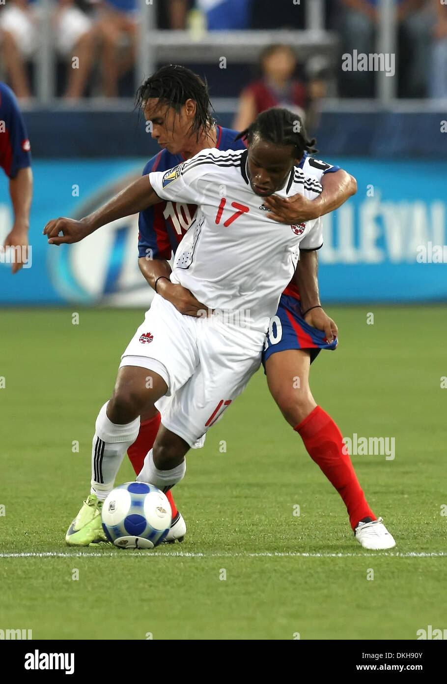 Jaime Peters (17) of Canada gets fouled by Walter Centro during the ...