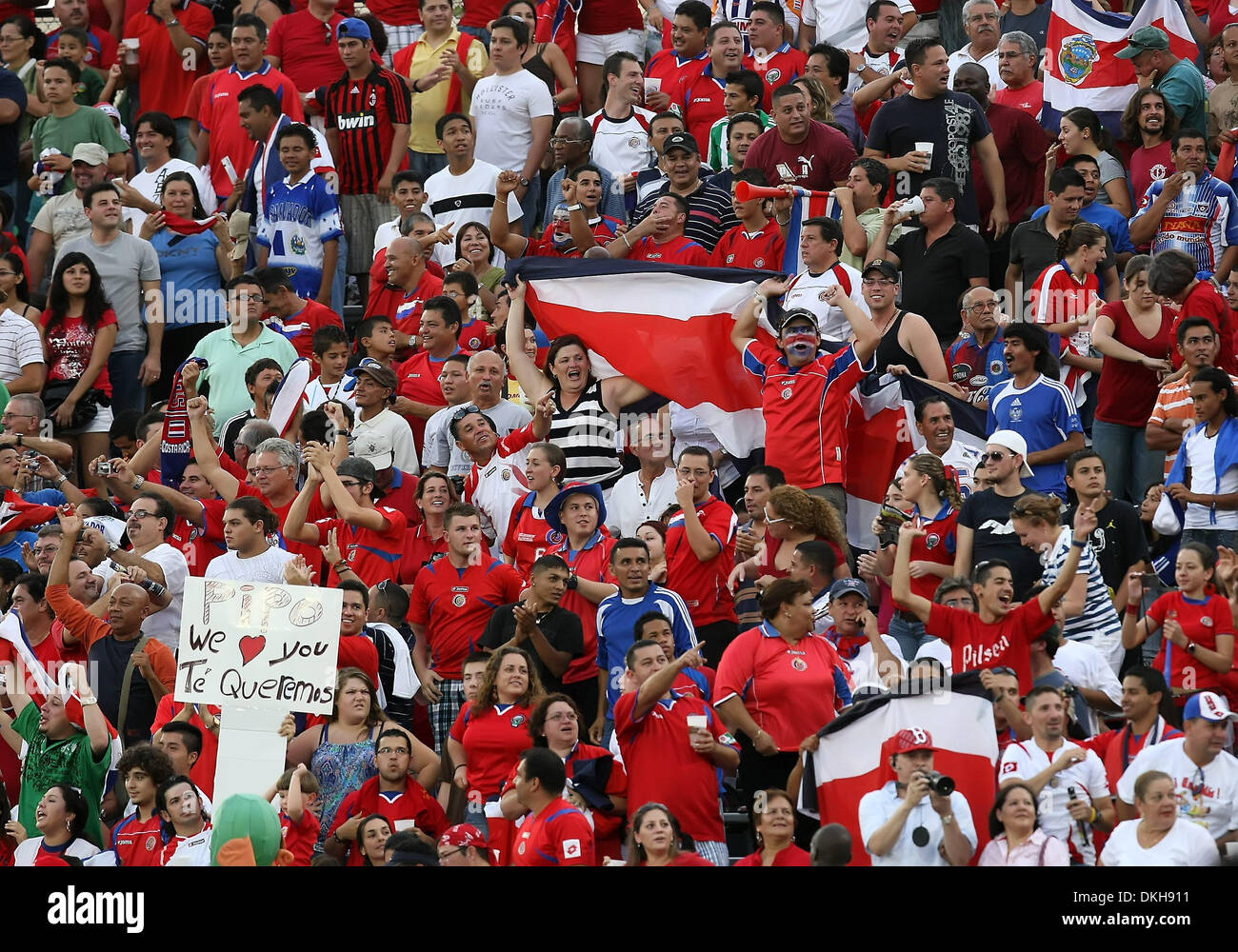 Costa Rican fans celebrate and watch the replay of a goal during the ...