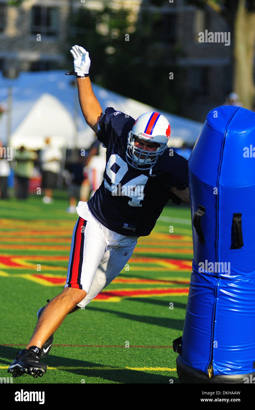 Buffalo Bills defensive end Aaron Schobel practices his swim move on a ...