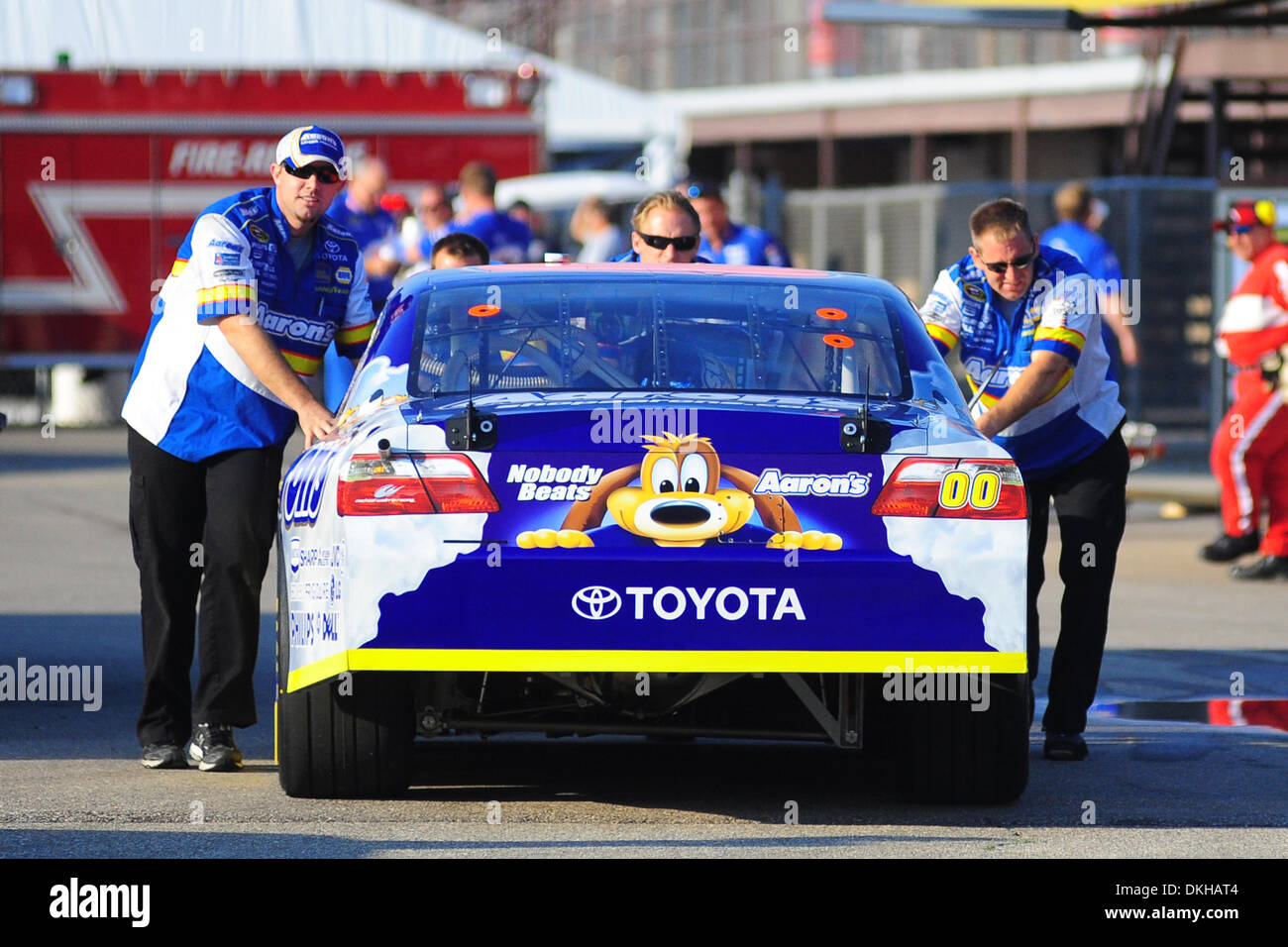 Crew members of the 00 Aaron's Dream Machine push the car through the ...