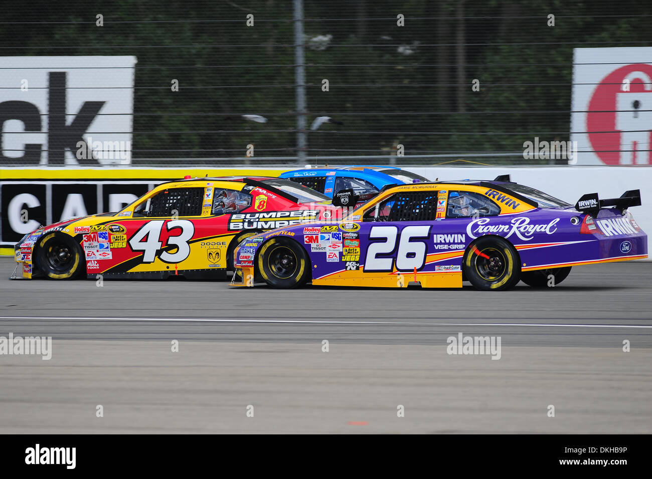 Jamie McMurray drives the Crown Royal Ford under Reed Sorenson on the ...