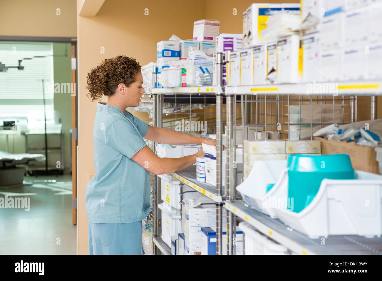 Nurse Working In Storage Room Of Hospital Stock Photo - Alamy