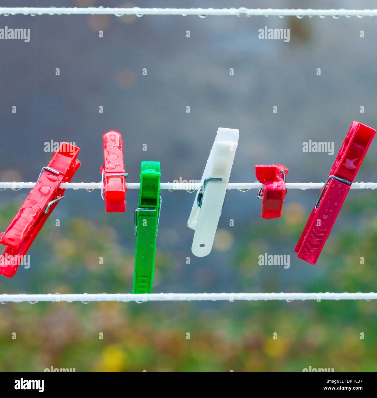 Colorful clips for washing laundry on strip rope outdoor. Background ...