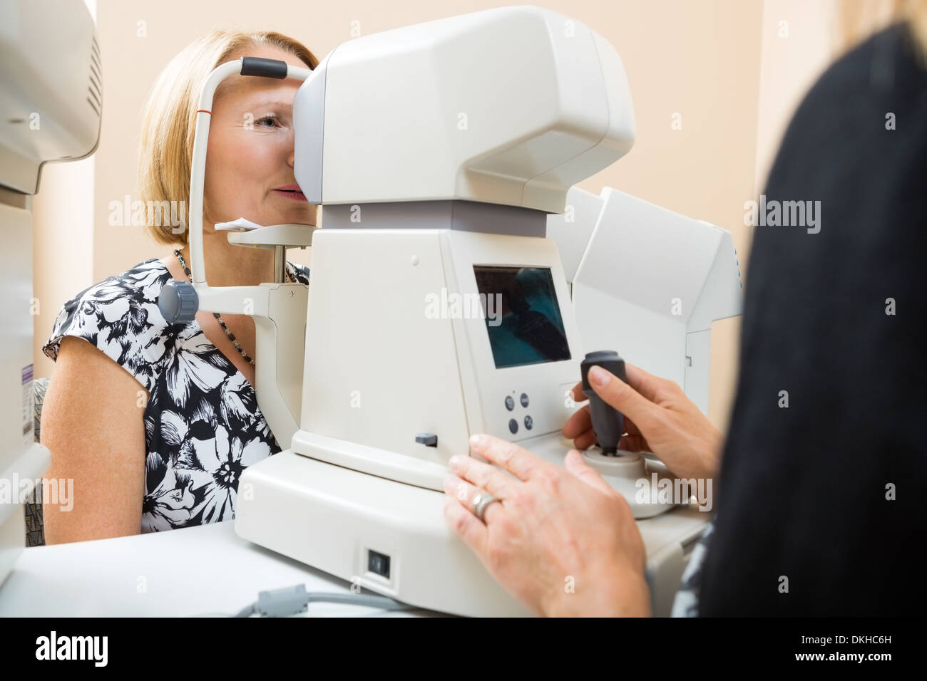 Optician Examining Patient's Eye With Tonometer Stock Photo - Alamy