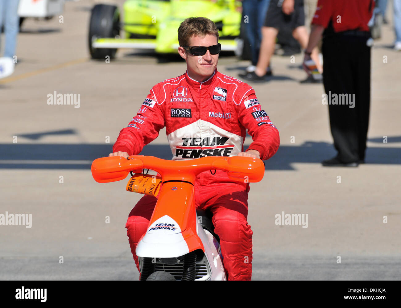 Team Penske driver Ryan Briscoe rides to pit road before the qualifying ...