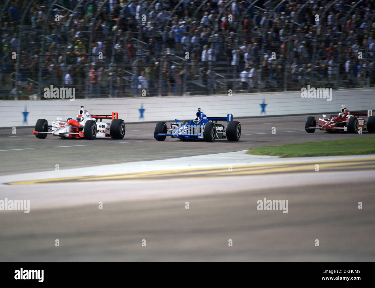 Ryan Briscoe drives the #6 Team Penske Dallara Honda in front of Dario ...