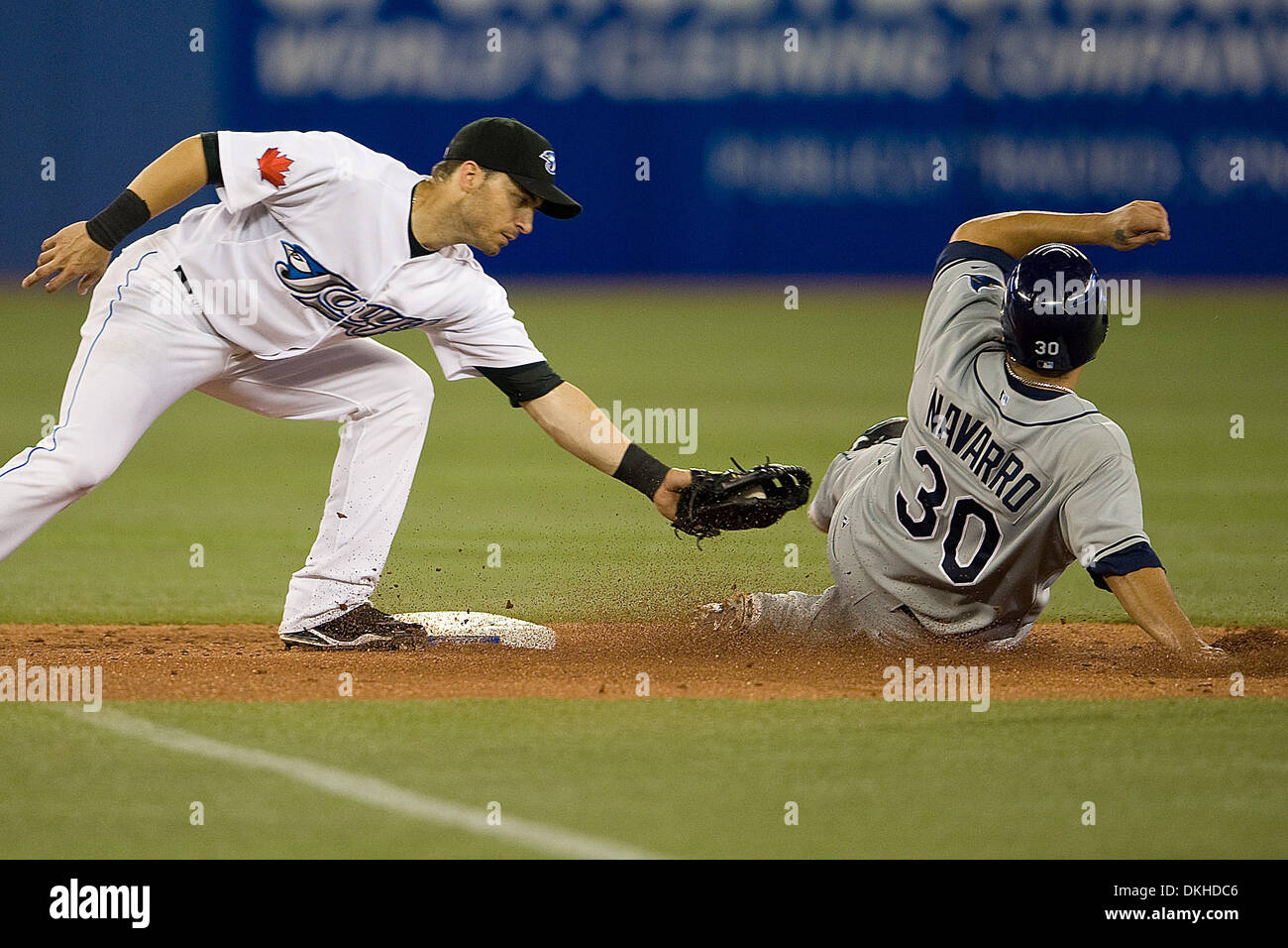 Tampa Bay Rays catcher Dioner Navarro is tagged out at second base ...