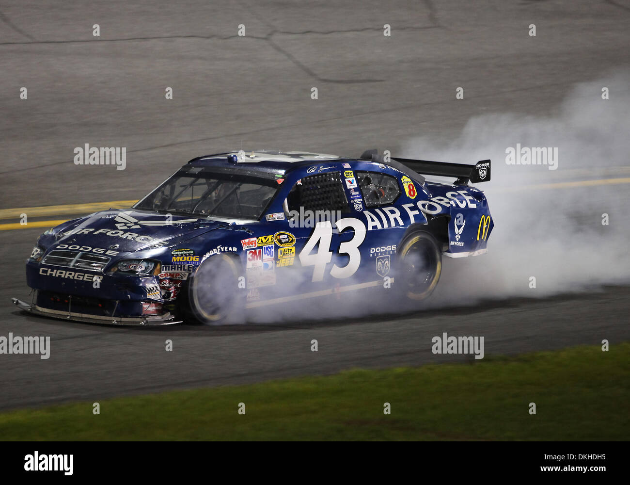 Reed Sorenson smokes through turn 4 during the NASCAR Coke Zero 400 ...