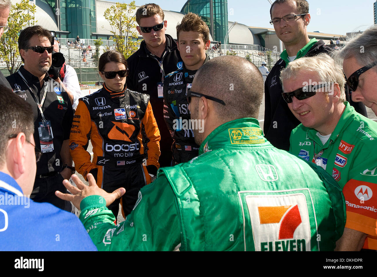 Micheal Andretti, Danica Patrick and Marco Andretti listen very ...